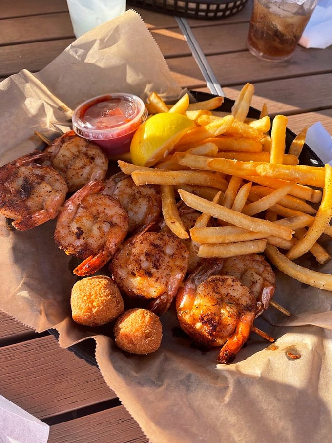 Blackened shrimp skewers with golden hush puppies—a taste of the Gulf that makes you wonder why you don't live at the beach year-round.