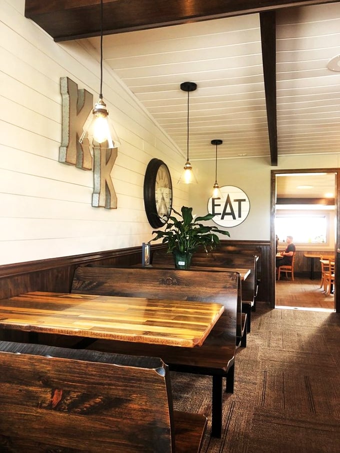 Wooden booths polished by generations of elbows, where the "EAT" sign isn't just decoration—it's the simplest, most honest mission statement possible.