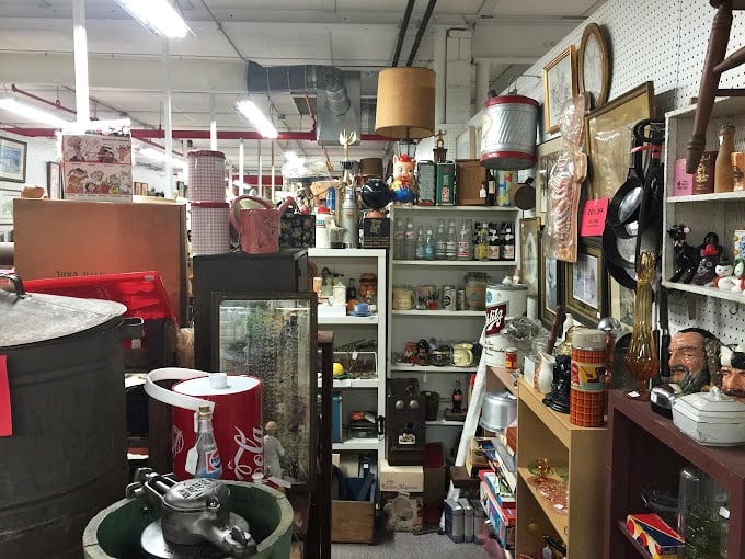 A booth that feels like raiding your coolest relative's basement – vintage Coca-Cola memorabilia mingles with collectibles spanning decades.