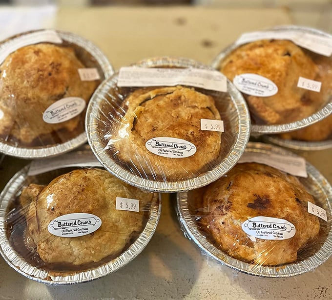 These aren't just pies – they're time machines to grandma's kitchen, wrapped in aluminum and sealed with nostalgia.