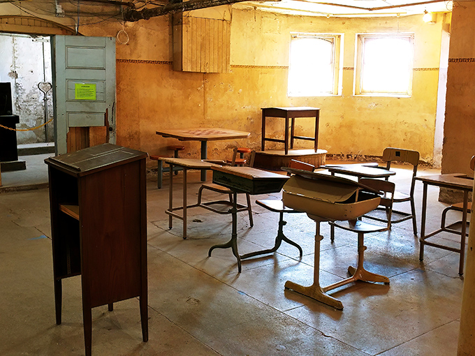 Abandoned desks await phantom students in this classroom where troubled youth once sought education as their pathway to a different future.