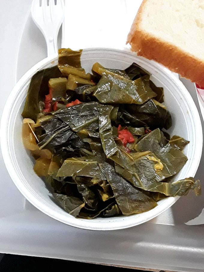 Collard greens swimming in pot liquor—the South's gift to Chicago, offering a moment of vegetable virtue in a fried food paradise.
