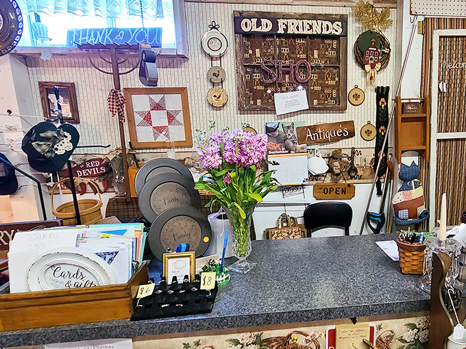 A vendor's counter blooms with personality and carefully arranged wares—that "Old Friends" sign perfectly captures the feeling of finding your collecting community.