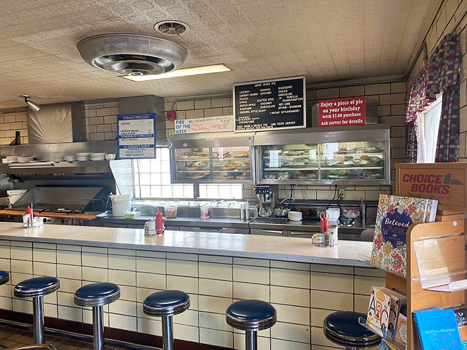 The counter and pie case – where life-changing dessert decisions are made daily. That glass display case has been responsible for more impulse purchases than any mall in America.