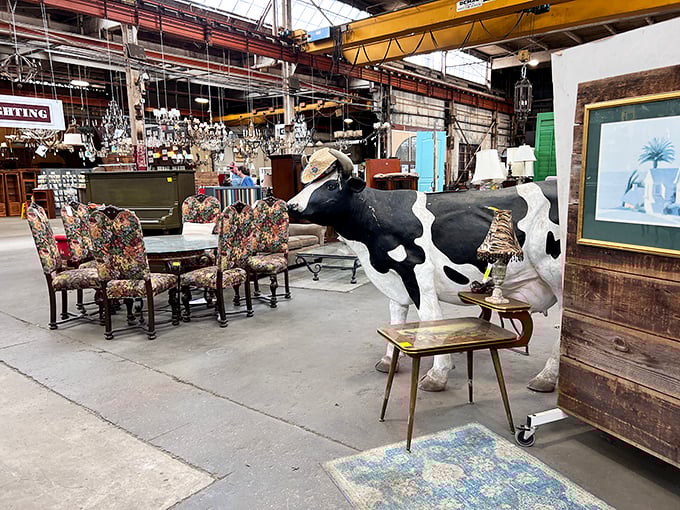 Nothing says "conversation piece" quite like a life-sized cow statue grazing between vintage chairs—the ultimate answer to "what's missing from my dining room?"