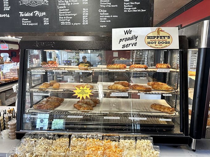 The display case—a museum of carbohydrate masterpieces where deciding becomes the hardest part of your pretzel pilgrimage.
