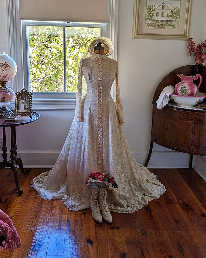This isn't just any wedding dress – it's a masterpiece of Victorian craftsmanship standing proudly as if its owner might return any moment to claim it.