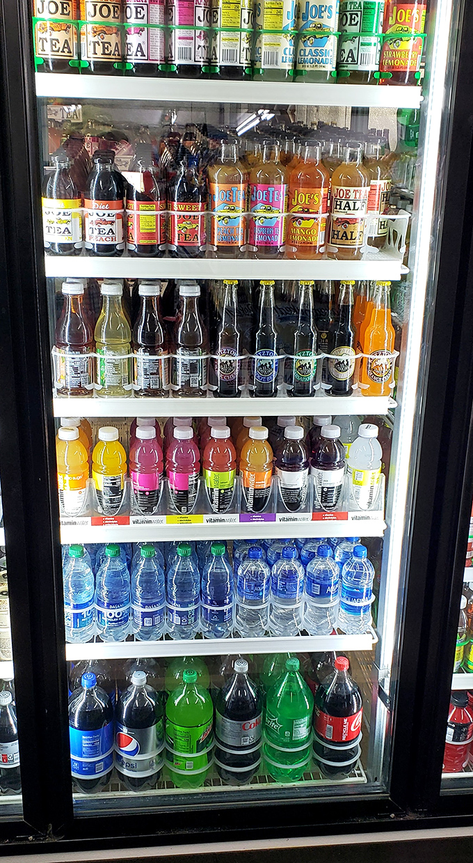 The beverage case – a colorful testament to America's unshakeable belief that every meal deserves its perfect liquid companion.