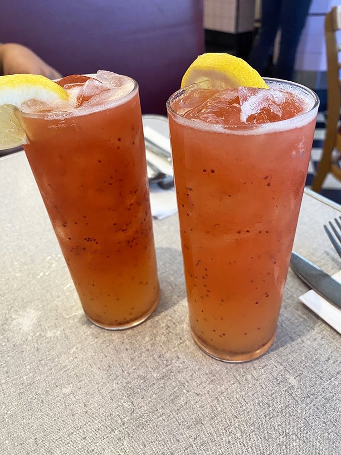 These aren't just Bloody Marys—they're morning salvation in glassware, speckled with pepper and promising to make your day infinitely better.