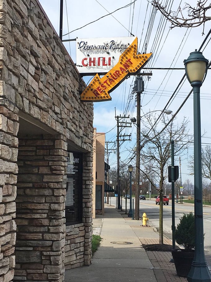 The view from inside feels like a portal between worlds—one foot in a timeless diner, one on a Cincinnati street that keeps changing.