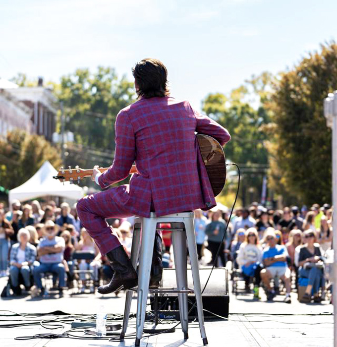 Milledgeville's festivals bring music to the streets and crowds to their feet. This performer's bold suit suggests the town's cultural scene is anything but understated.