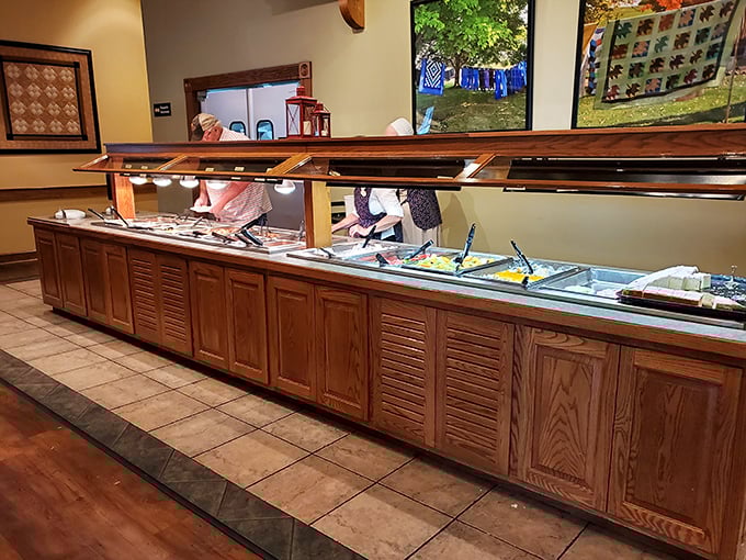 The buffet stretches like a wooden runway of possibility, each steaming tray promising flavors that haven't been compromised by time or trend.