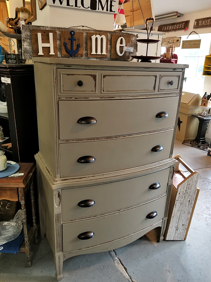 This beautifully distressed dresser topped with nautical-themed "HOME" sign is farmhouse chic without the boutique markup—perfection!