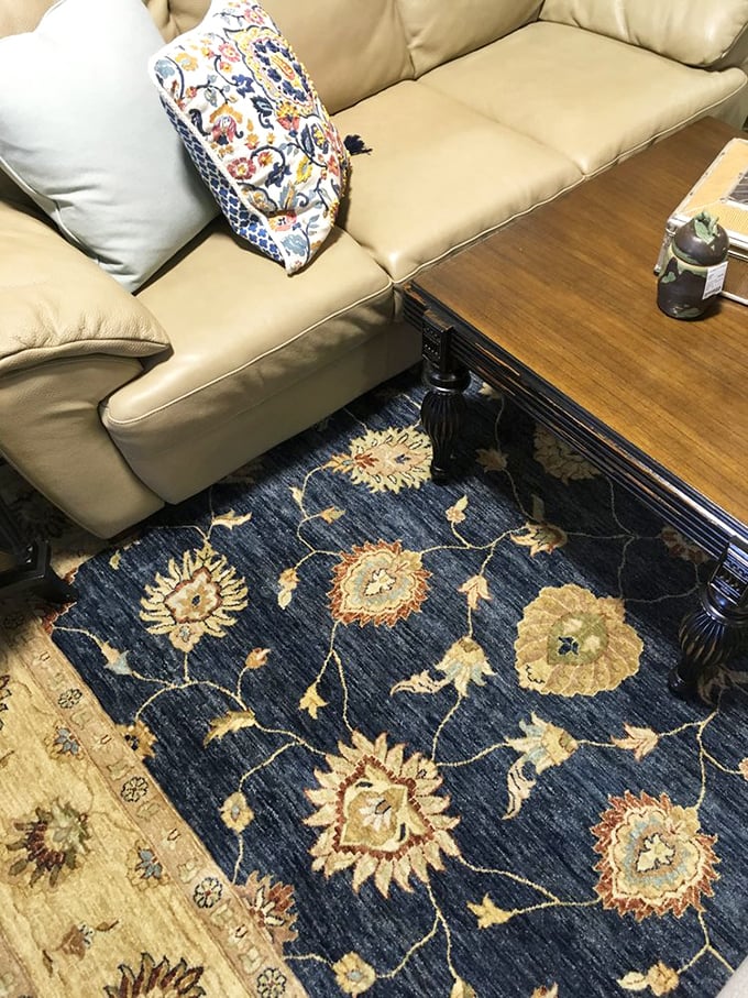 A rug that doesn't just lie there but tells stories—each floral motif a chapter in craftsmanship that elevates any living space.