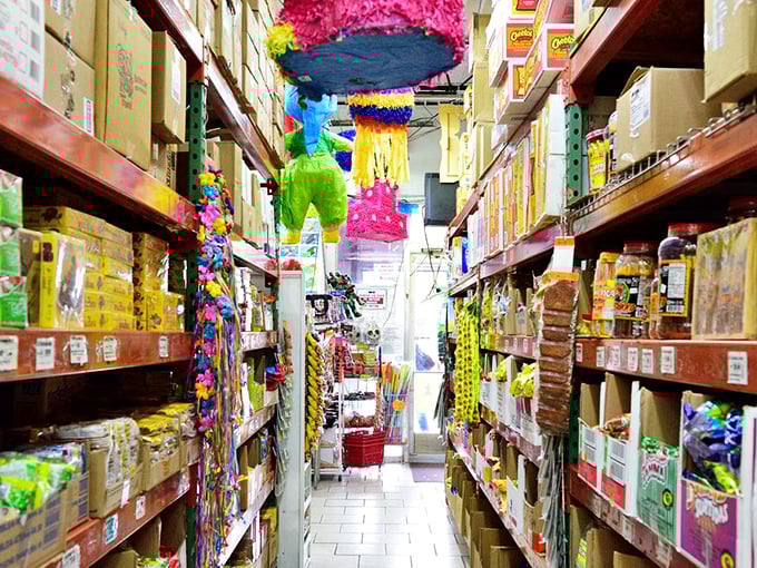 Piñatas and party supplies hang overhead like festive stalactites in this cave of wonders for celebration planners.