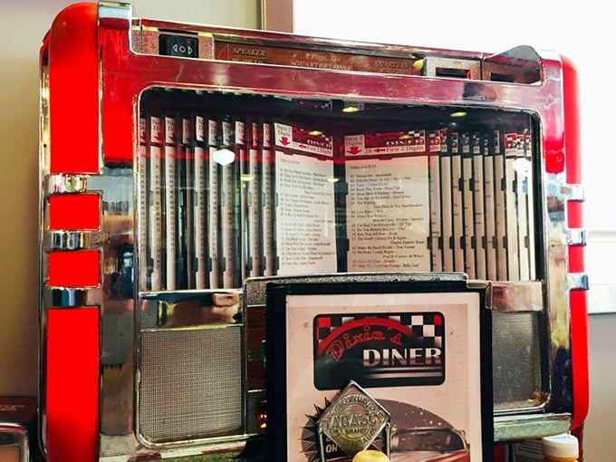 The classic jukebox isn't just decoration—it's a time portal offering musical accompaniment to your meal, one quarter and three songs at a time.