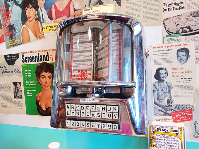 The tabletop jukebox—where a quarter still buys happiness. Choose wisely; your booth's soundtrack depends on it.