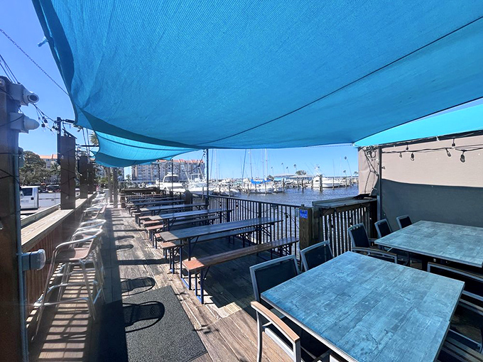 Outdoor dining where the breeze does the seasoning. Simple tables with million-dollar views under Florida's impossibly blue sky.