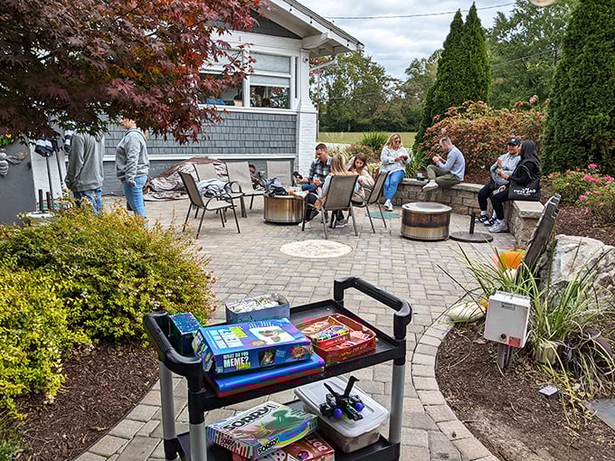The outdoor waiting area isn't just practical – it's a social scene complete with games to distract you from how hungry you're becoming.