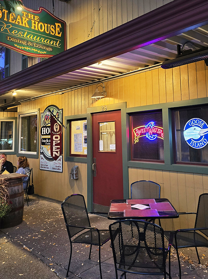 Evening ambiance with neon beer signs glowing like beacons of hospitality—sidewalk seating for those perfect Pennsylvania nights.
