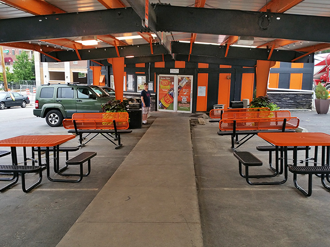Al fresco dining, drive-in style. These outdoor tables offer the perfect perch to enjoy your Triple XXX feast while soaking in the distinctive orange and black ambiance.