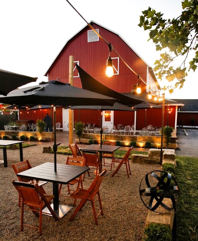 Al fresco dining with string lights transforming a simple barn exterior into Ohio's answer to a Tuscan evening—just add prime rib.
