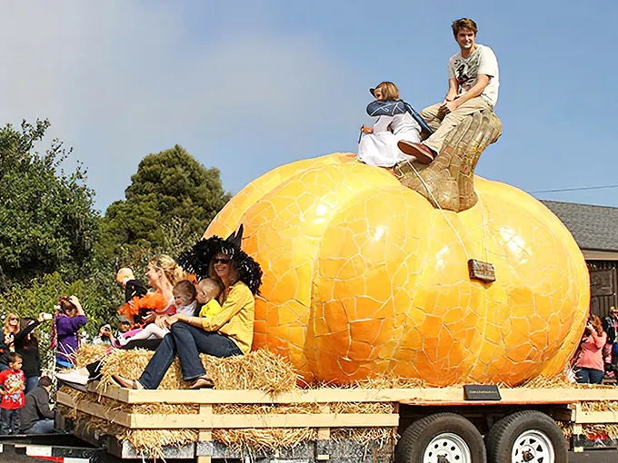 Nothing says "small-town autumn" quite like a parade featuring a giant pumpkin chariot. Halloween magic, Mount Carroll style!