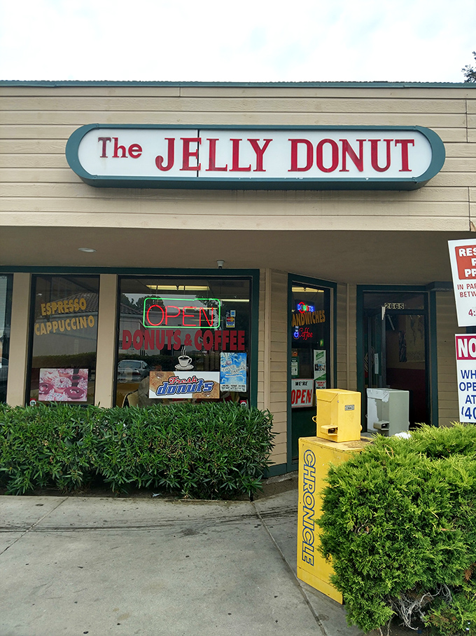 The Jelly Donut's straightforward sign makes a simple promise it fully intends to keep – deliciousness awaits within.