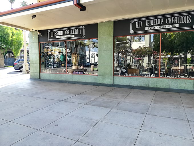 The elegant green and cream façade of Mission Galleria – where history meets retail therapy.
