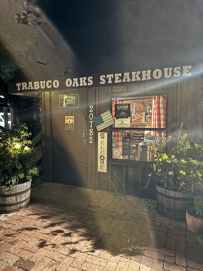 Night falls on Trabuco Oaks Steakhouse – inside, flames kiss massive steaks while ties tremble in fear.
