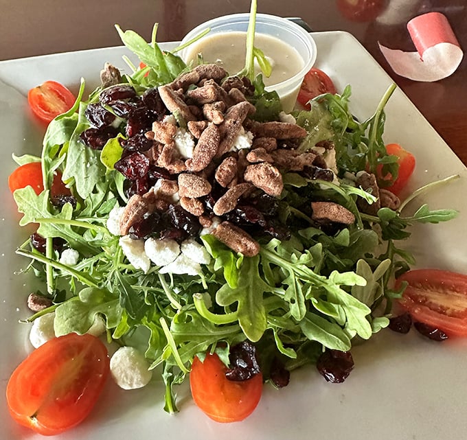 This isn't just a salad – it's a refreshing counterpoint to hearty German fare, where arugula, cranberries, and walnuts dance together in perfect harmony.