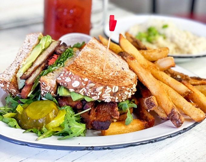 This isn't just a sandwich – it's architecture with purpose, where every layer from avocado to pork belly creates the perfect structural integrity.