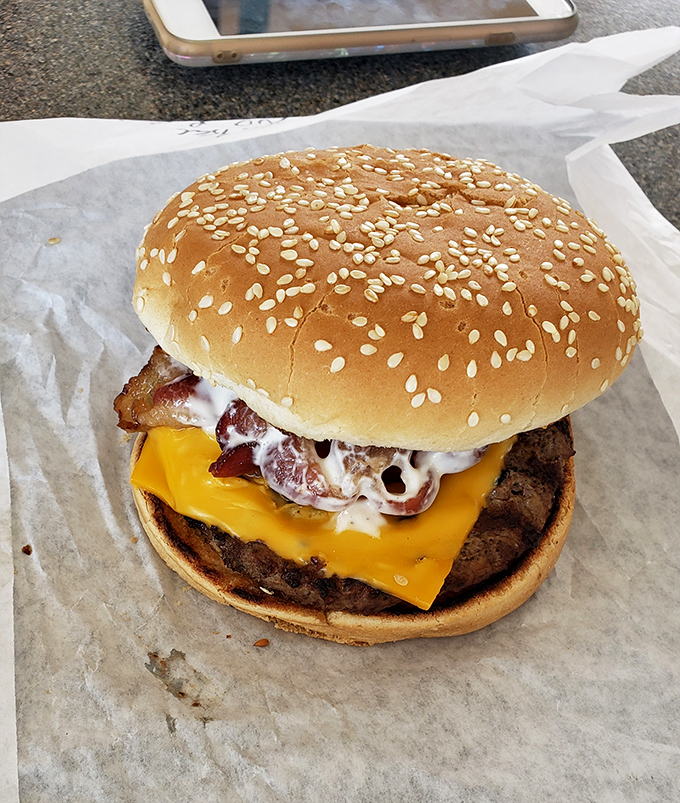 The bacon ranch burger – where three perfect foods unite in harmony. Not all heroes wear capes; some come wrapped in wax paper.