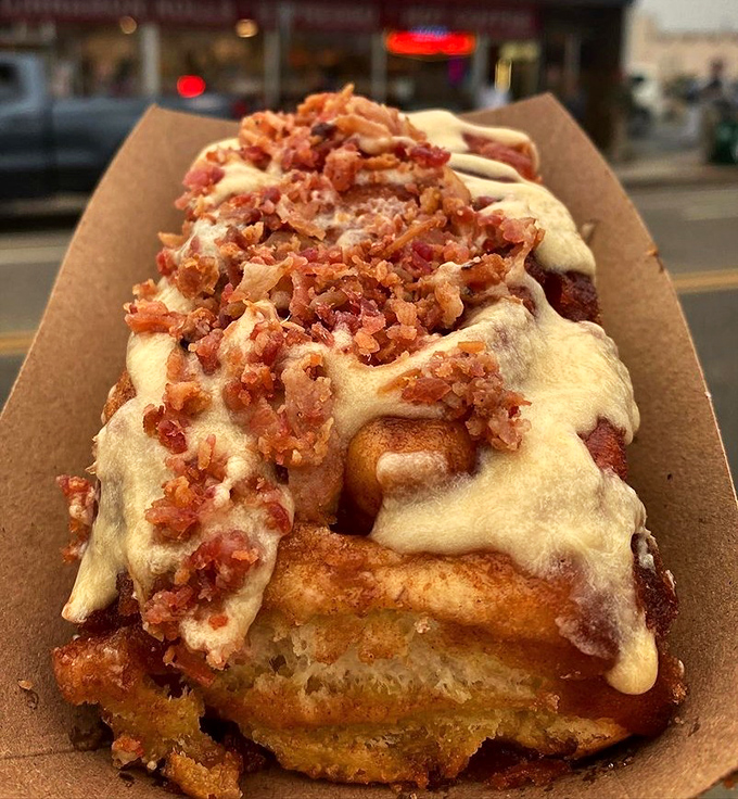 The maple-bacon roll—where breakfast meets dessert in perfect harmony. It's what would happen if a cinnamon roll and breakfast platter eloped.