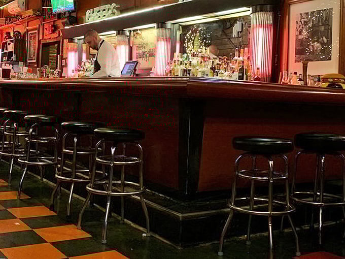 The bar at Tessaro's—where strangers become friends, friends become regulars, and everyone becomes an evangelist for proper burger technique.