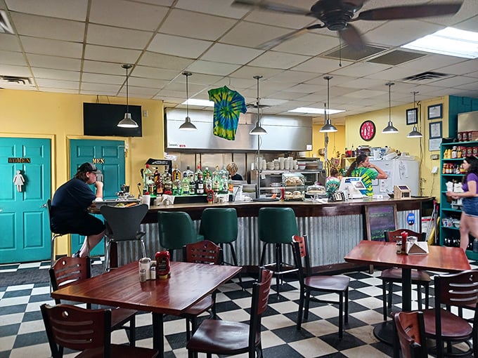 The heart of Damascus Diner – where tie-dye meets corrugated metal in a counter space that invites solo diners to feel right at home.