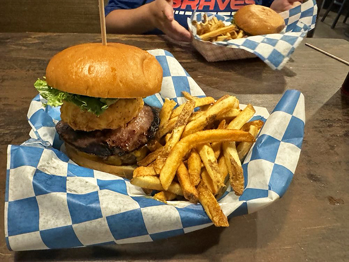 The Beaufort Burger stands tall and proud, a skyscraper of flavor with what appears to be a fried green tomato playing a starring role.