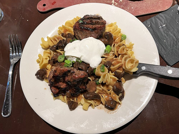 Beef stroganoff reimagined with steakhouse flair. Those medallions aren't just sitting on pasta—they're holding court on a throne of noodles.