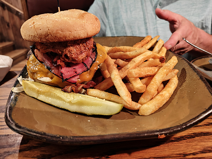 A burger that requires jaw exercises beforehand—medium-rare beef, melted cheese, and is that... yes, that's prime rib ON the burger. Magnificent madness.