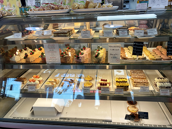A glass case of temptation that should come with a warning label. These aren't just desserts – they're edible art with a sugar high.