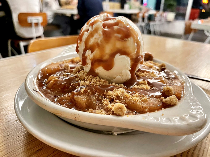 This dessert doesn't just end the meal—it provides closure. Warm apple crisp with ice cream melting into caramel creates the perfect sweet finale.