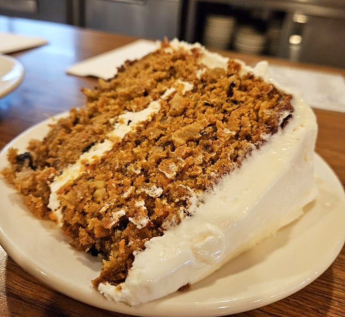 Carrot cake that doesn't skimp on the good stuff—moist layers, generous frosting, and enough heft to make you feel like you've accomplished something.