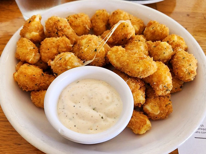 Golden-fried cheese curds with a side of creamy dipping sauce—proof that appetizers before breakfast should be more socially acceptable.