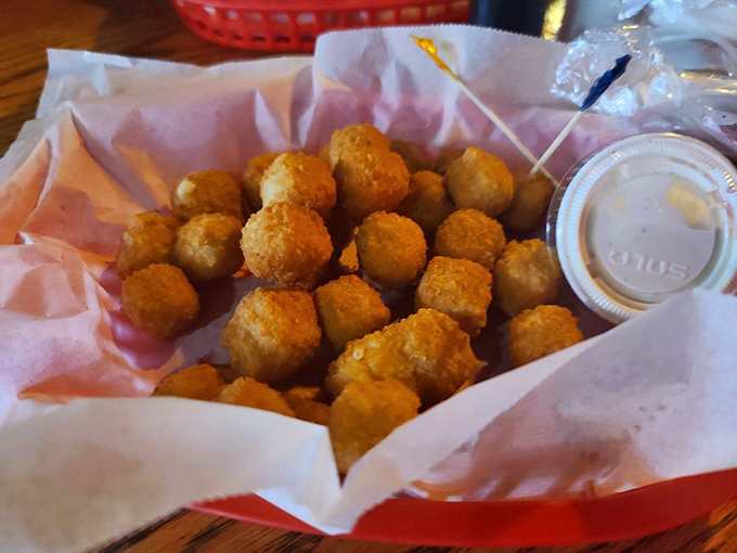Golden-fried cheese curds – little nuggets of joy that somehow manage to disappear from the basket faster than you can say "just one more."