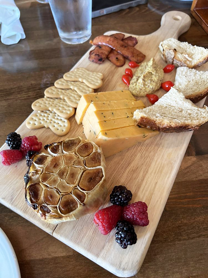 Cheese and charcuterie presented with artistic flair—a wooden board of possibilities where every bite tells a different delicious story.