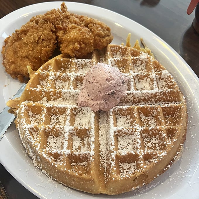 The eternal breakfast debate—sweet or savory—solved on a single plate. Golden waffle meets crispy chicken in a combination that shouldn't work but absolutely does.