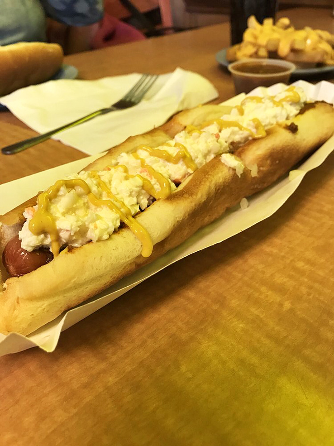 The footlong—where chili and coleslaw create a harmony so perfect, symphony conductors should take notes. Yellow mustard provides the high notes.