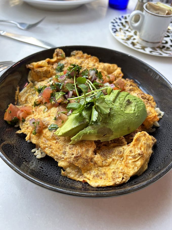 An omelet that refuses to be ordinary. Stuffed with savory goodness and topped with fresh avocado—breakfast with ambition.