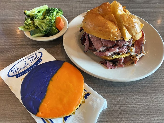 A study in contrasts! The towering Chris Paulstrami sandwich stands proudly beside a cookie sporting Phoenix Suns colors – local pride never tasted so good.