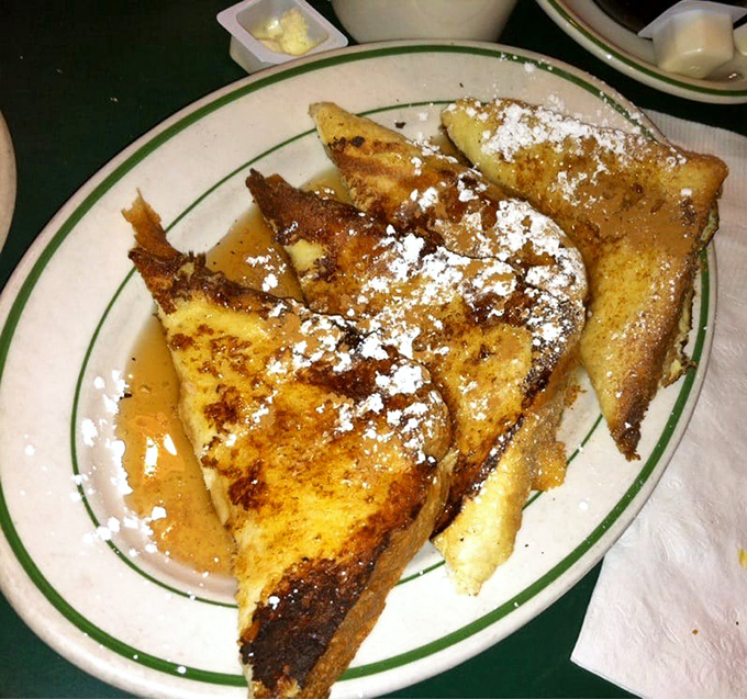 French toast that doesn't need a passport to transport you to breakfast nirvana—just powdered sugar and a willing appetite.